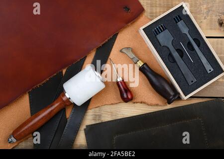 Leatherworker's tools on a wooden workbench Stock Photo - Alamy