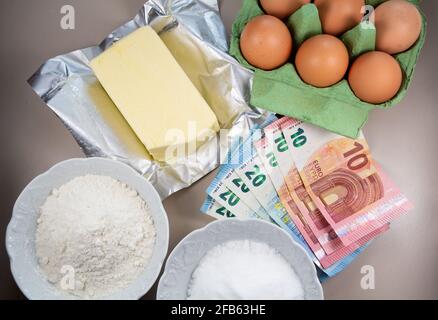 Euro banknotes with flour in paper bag on wicker tray for food prices ...