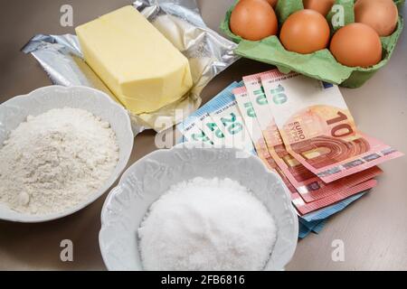 Euro banknotes with flour in paper bag on wicker tray for food prices ...