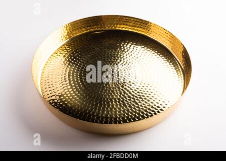 Empty oval or round shape thali or plate made up of brass, pital or ...