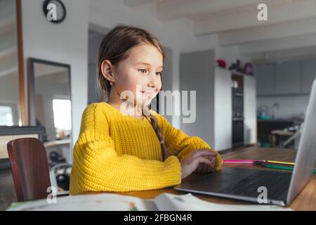 cute girl using laptop at home Stock Photo - Alamy