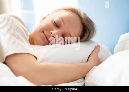 Young woman sleeping at home Stock Photo - Alamy