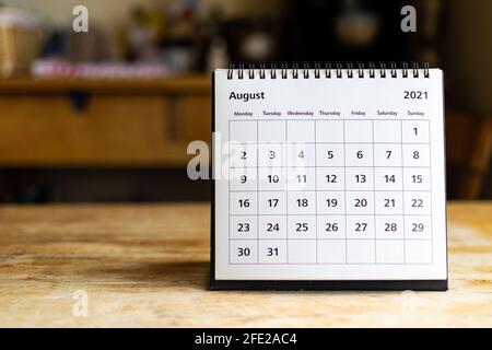 August 2021 calendar - month page showing date and vintage clock on ...