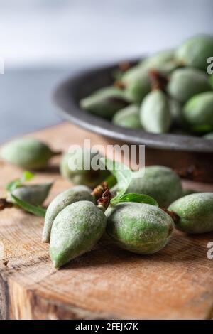 Whole fresh raw green almonds Stock Photo - Alamy