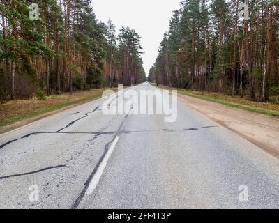 endless beautiful country gravel road in perspective with dust and sun ...