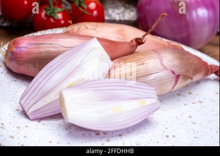 Onion collection, pink French shallot onlons close up Stock Photo - Alamy