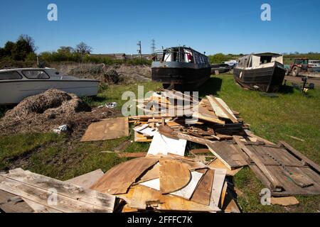 Scattered junk in a boat salvage yard Stock Photo - Alamy
