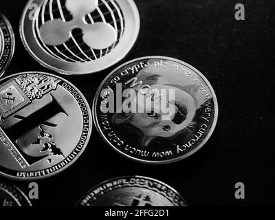 Grayscale shot of gold and silver crypto currencies Stock Photo - Alamy