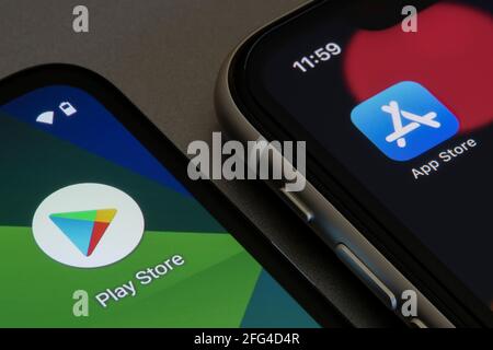 Apple App Store and Google Play Store icons are seen respectively on an ...