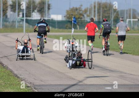 Disabled Athletes training with their Hand Bikes with Cyclist and ...