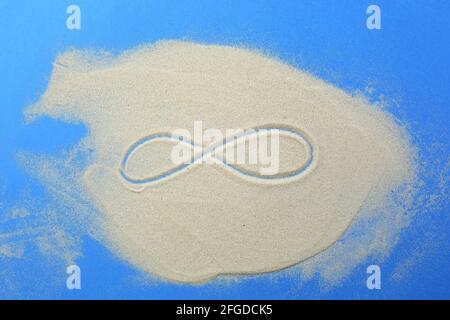 infinity symbol written on sand Stock Photo - Alamy