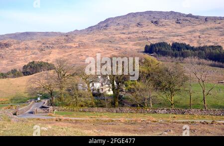 Cockley Beck Farm behind trees at Cockley Beck, Duddon Valley, Cumbria ...