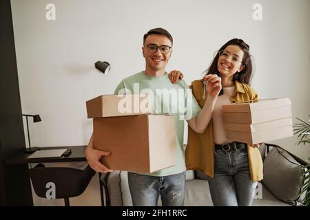 Young family moving to new apartment Stock Photo - Alamy