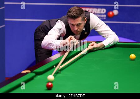 Mark Selby of England plays a shot to Noppon Saengkham of Thailand at ...