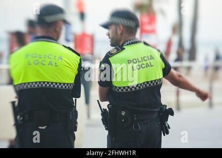 Spanish police squad formation back view with "Local Police" logo ...