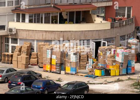 Piles of Amazon delivery boxes and parcels on the street outside an ...