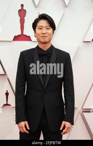 Erick Oh arrives at the Oscars on Sunday, April 25, 2021, at Union ...