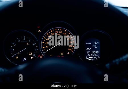 Car dashboard with speedometer, odometer and tachometer and indicator ...