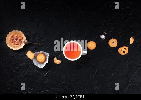 Flat lay composition of five golden fried spring rolls topped with ...