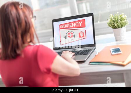 Laptop screen displaying an emergency concept Stock Photo - Alamy