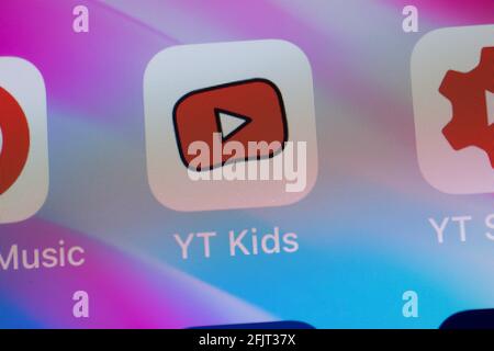 YouTube Kids app logo on Google Play store is shown on tablet screen ...