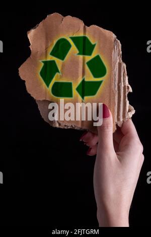 woman holding up a ripped sign with the word credit card debt written ...