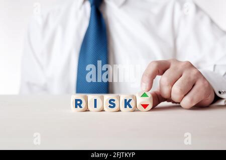 Business and economy concept. The businessman turns the regulator on ...