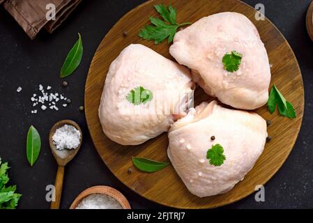 Raw chicken thighs for cooking over board Stock Photo - Alamy
