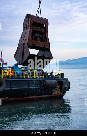Batumi, Georgia - 08 February 2021: Yellow crane in a cargo port ...