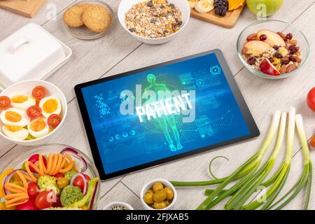 Tablet Pc with fruits, medical concept Stock Photo - Alamy