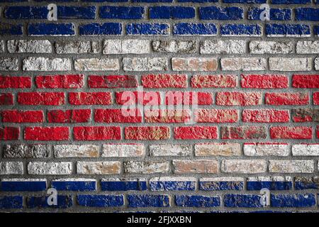 National flag of Costa Rica depicting in paint colors on an old brick ...