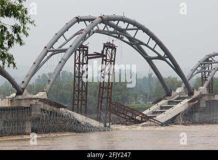 Luoyang, China. 25th Apr, 2021. A footbridge was washed out by the ...