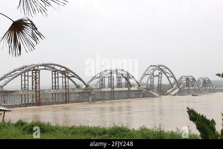 Luoyang, China. 25th Apr, 2021. A footbridge was washed out by the ...