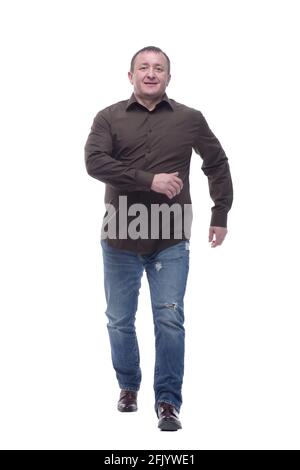 in full growth. satisfied casual man striding forward Stock Photo - Alamy