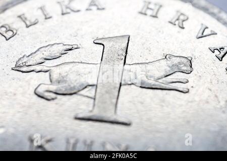 A fragment of croatian metal coin macro photo of one kuna. Selective ...