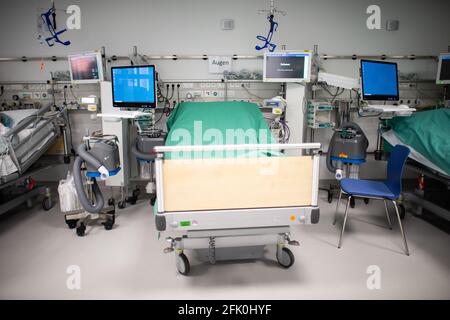 in an operating room stands an almost full suction cup filled with ...