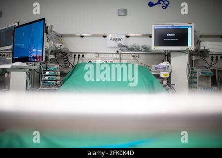 in an operating room stands an almost full suction cup filled with ...