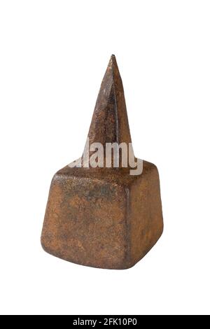 An old metal anvil for punching a hand scythe. Rusty object isolated on ...
