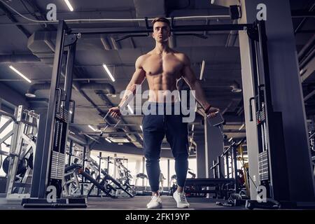 Muscular Fitness Bodybuilder Doing Heavy Weight Exercise For Shoulders ...