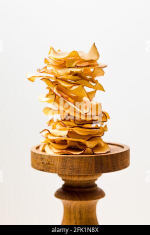 Tower of round dried slices of apple on the green Stock Photo - Alamy