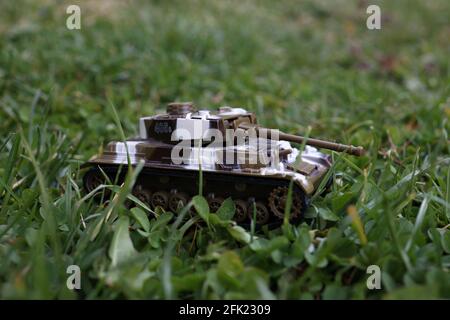Plastic toy armor stands in the grass Stock Photo - Alamy