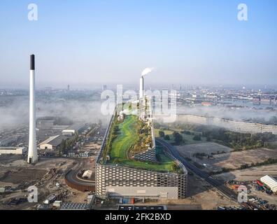 View with clouds, facade and context. CoppenHill Power Plant ...