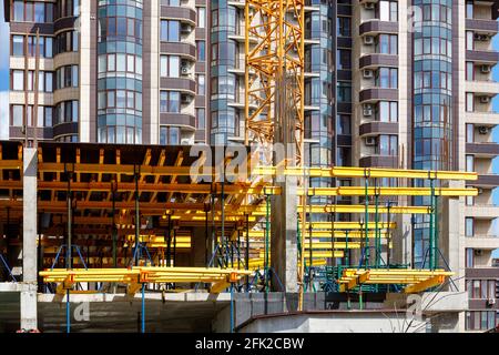 Construction of new buildings in a monolithic-frame way using a formwork system. Vertical image ...