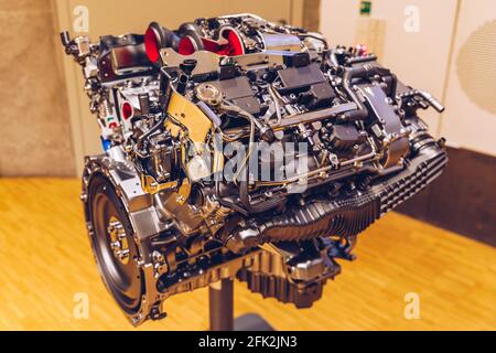 Metallic car engine control unit with plastic elements on a white ...