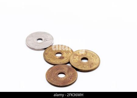 Coins with a hole in the middle Stock Photo - Alamy