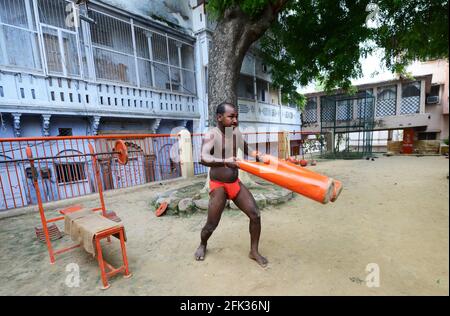 An Indian pehlwan exercising with Indian clubs in Varansai, Uttar ...