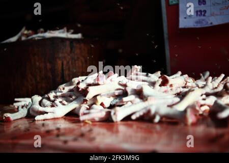 Chicken claws in very dirty and unhygienic chicken shop in butchery ...