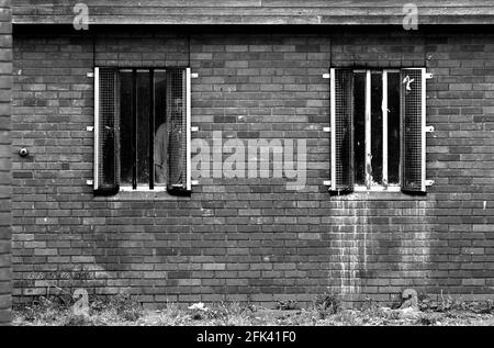 prisoner looking out of the window of a prison cell Stock Photo - Alamy
