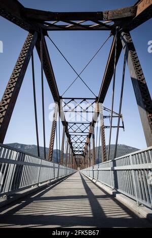 An old steel bridge repurposed into a walking path near Clark Fork ...