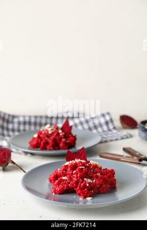 Plates with tasty beet risotto on light background Stock Photo - Alamy